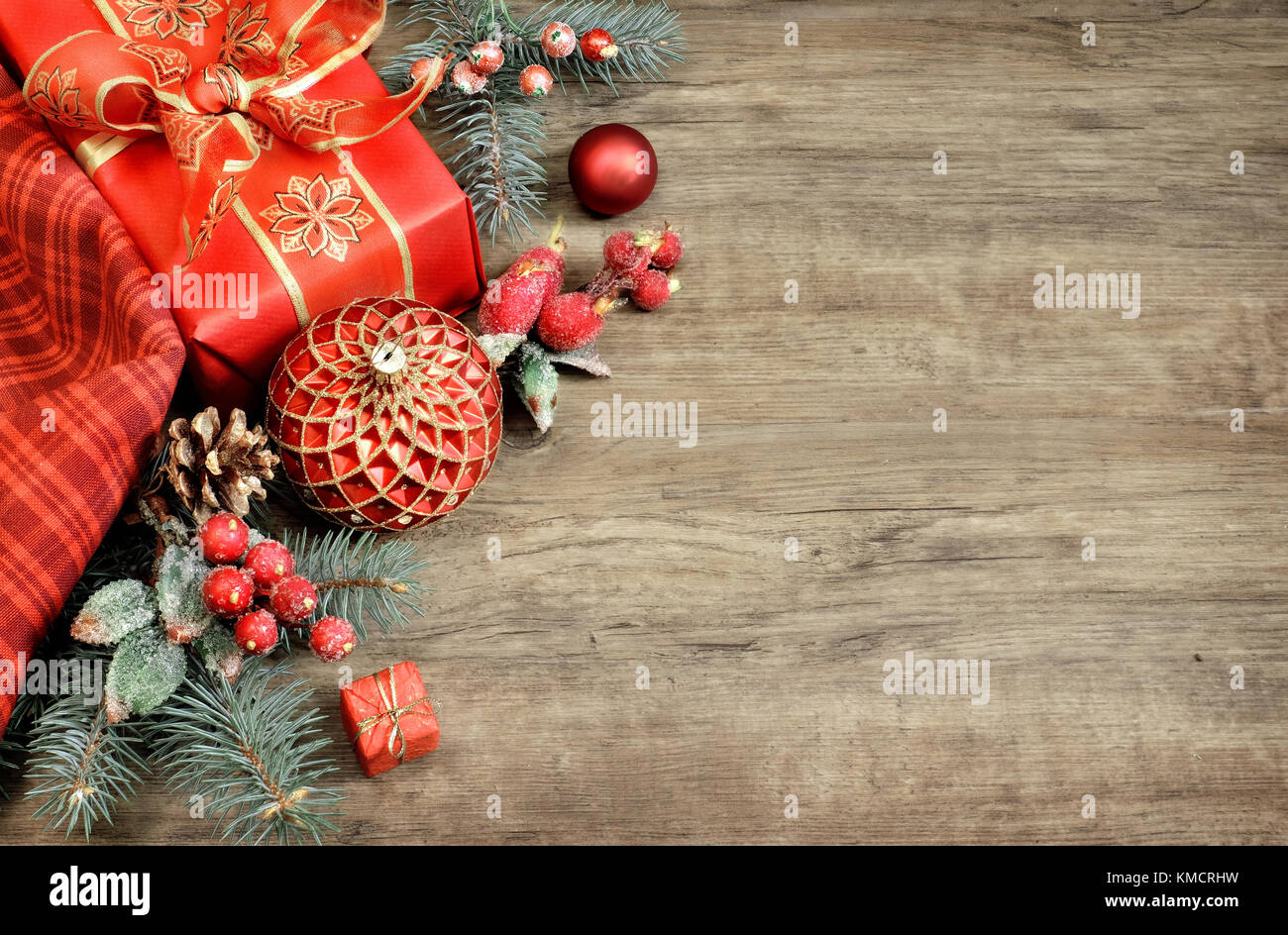 Corner composition with wrapped gift box and Christmas decorations on ...