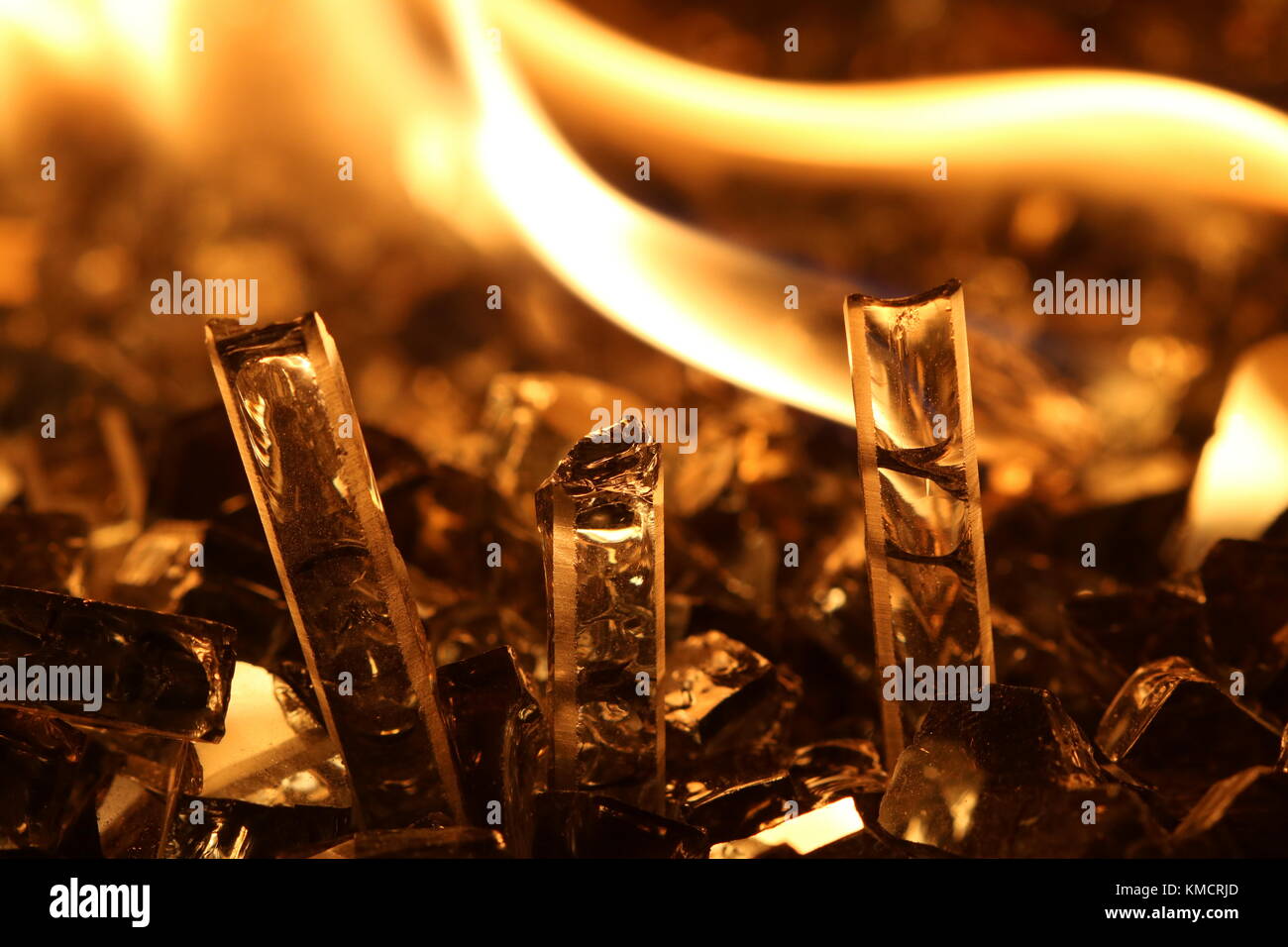 Some burning glass on a table-top fire Stock Photo - Alamy
