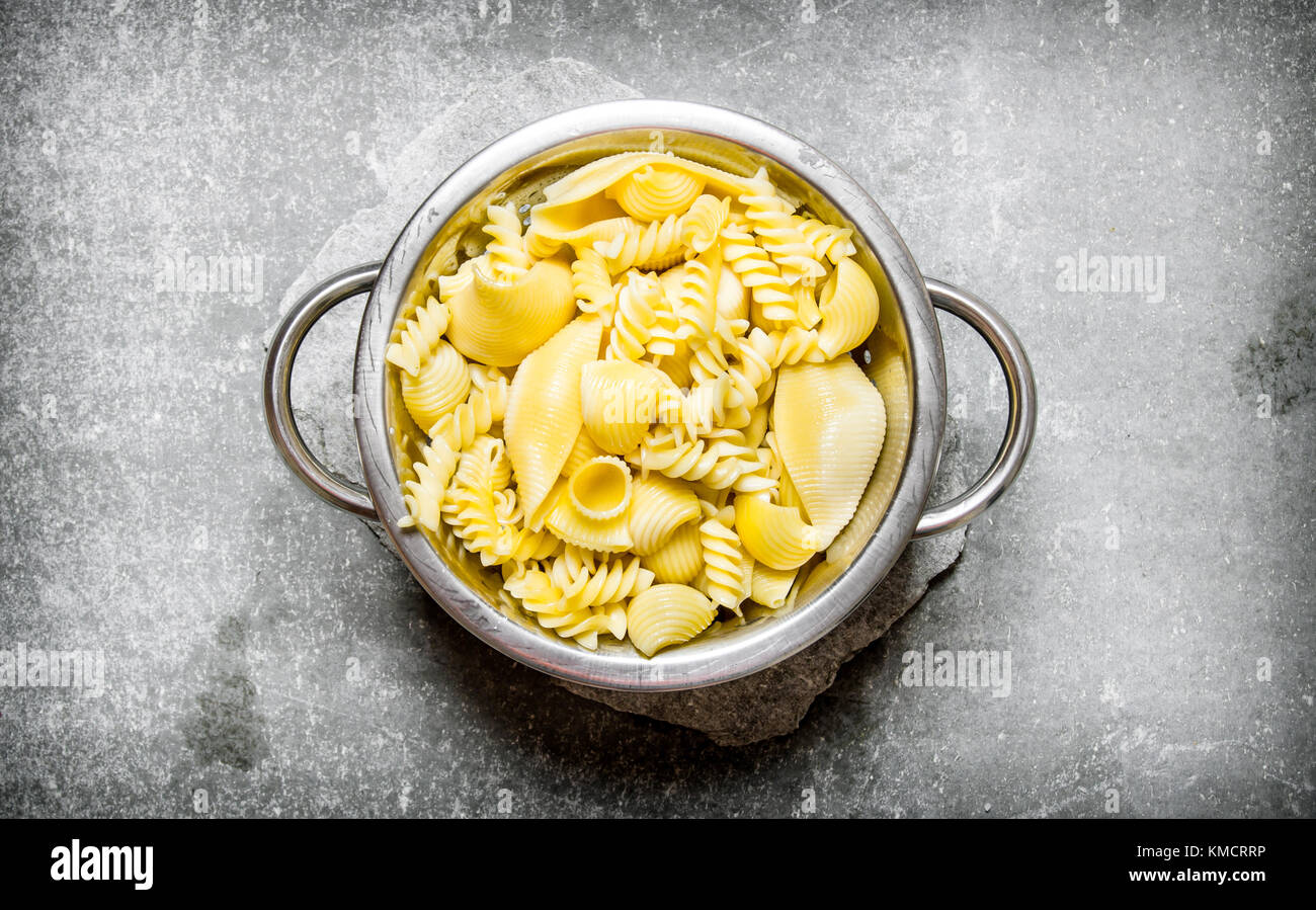 Boiled pasta in the pan . On a stone table. Top view Stock Photo - Alamy