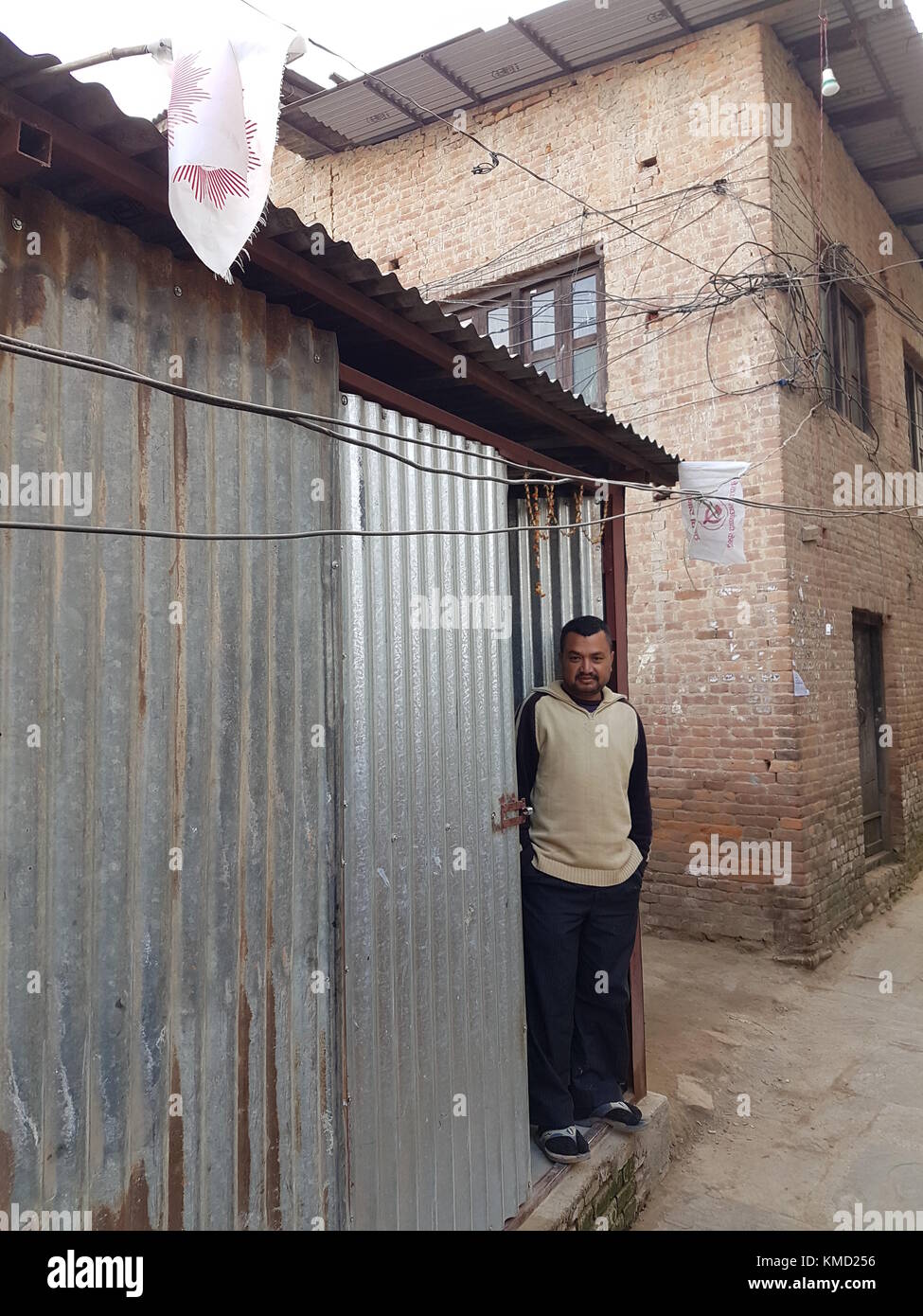 Kathmandu, Nepal. 05th Dec, 2017. Manik Shakya stands at the entrance ...