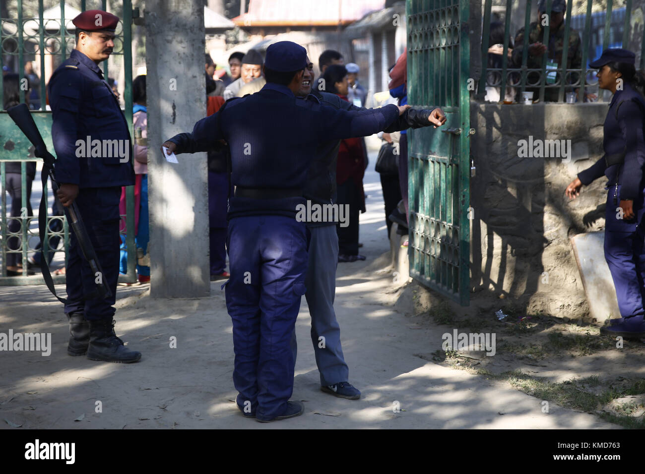 Kathmandu, Nepal. 7th Dec, 2017. A Police conducts security check to a ...
