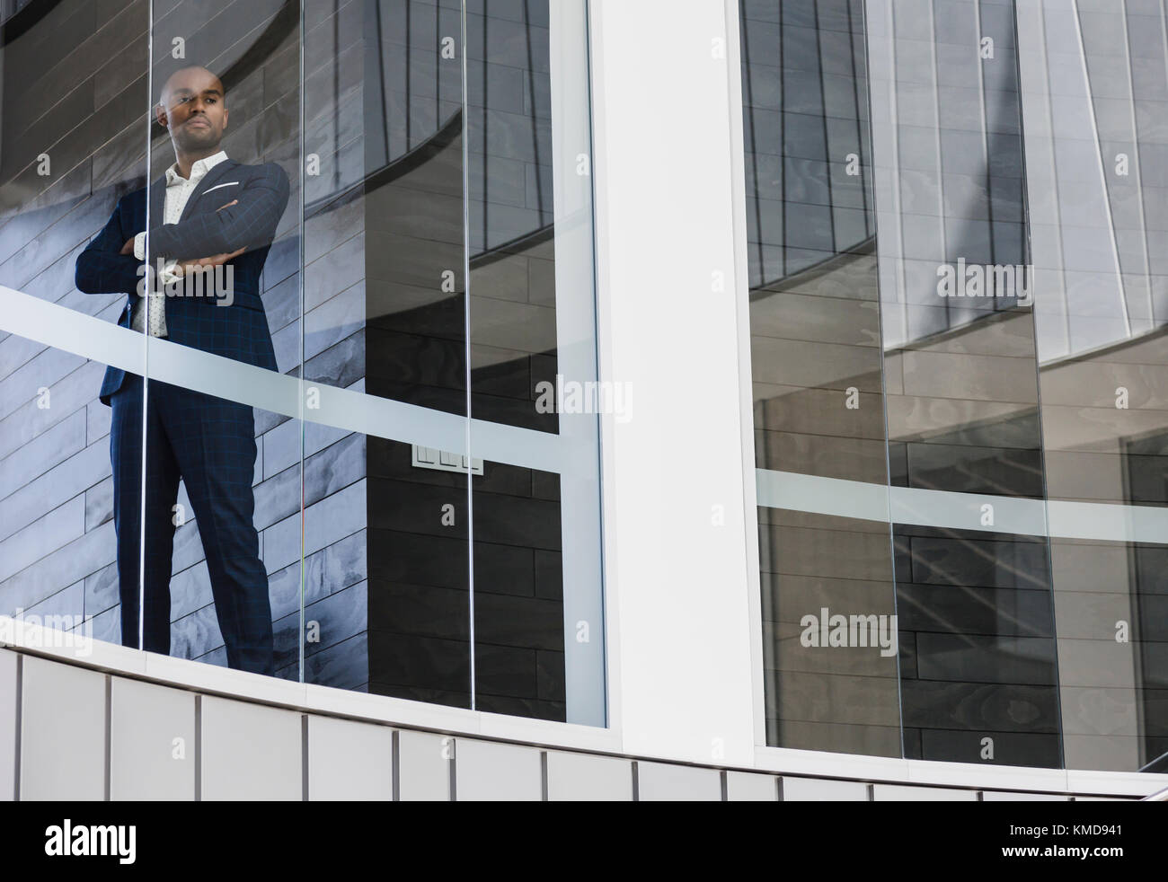 Portrait confident CEO businessman standing in office window Stock ...