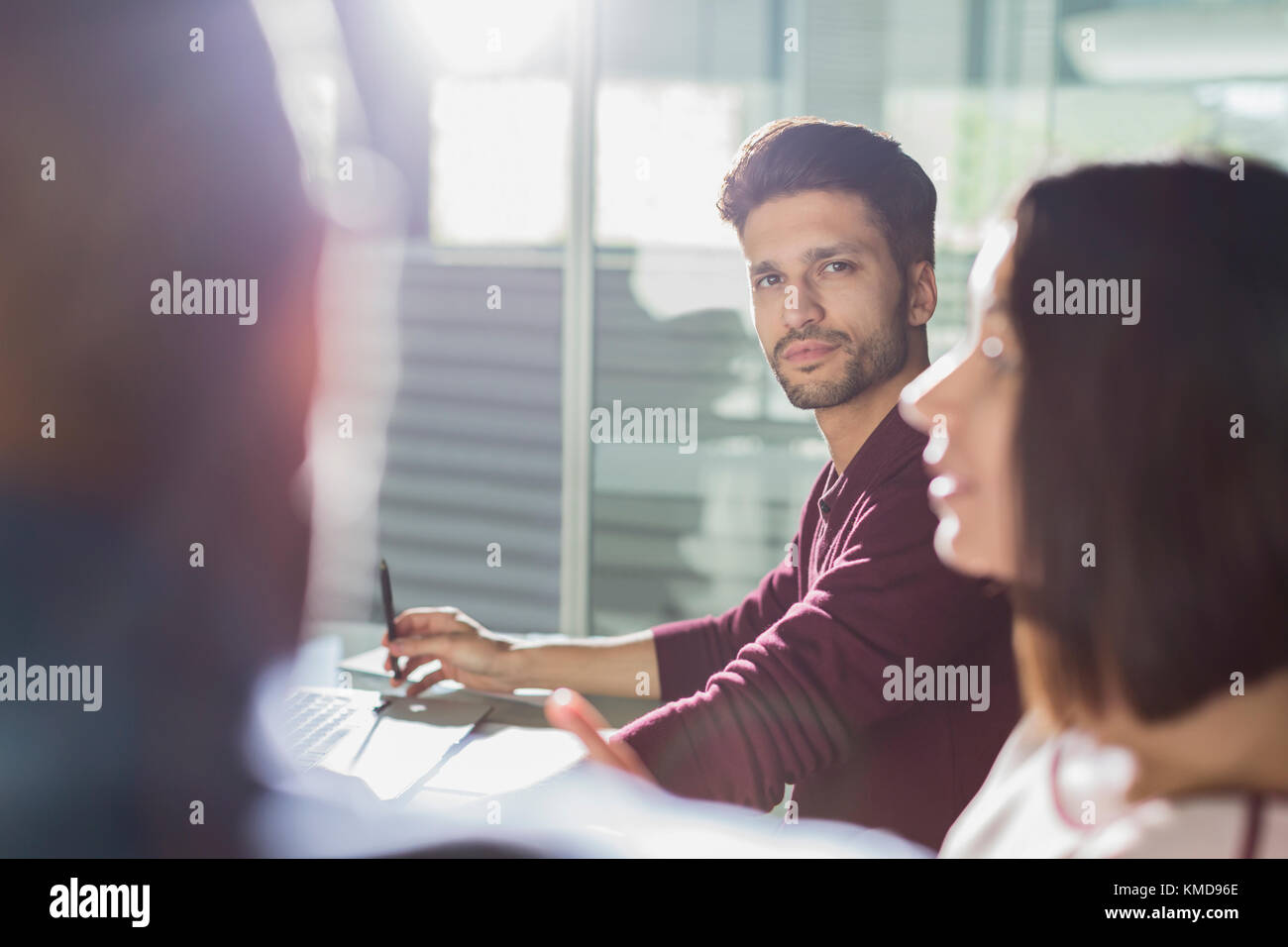 Serious businessman listening in conference room meeting Stock Photo ...