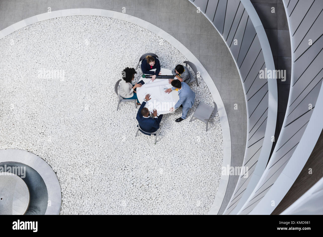 View from above architects meeting in atrium courtyard Stock Photo - Alamy
