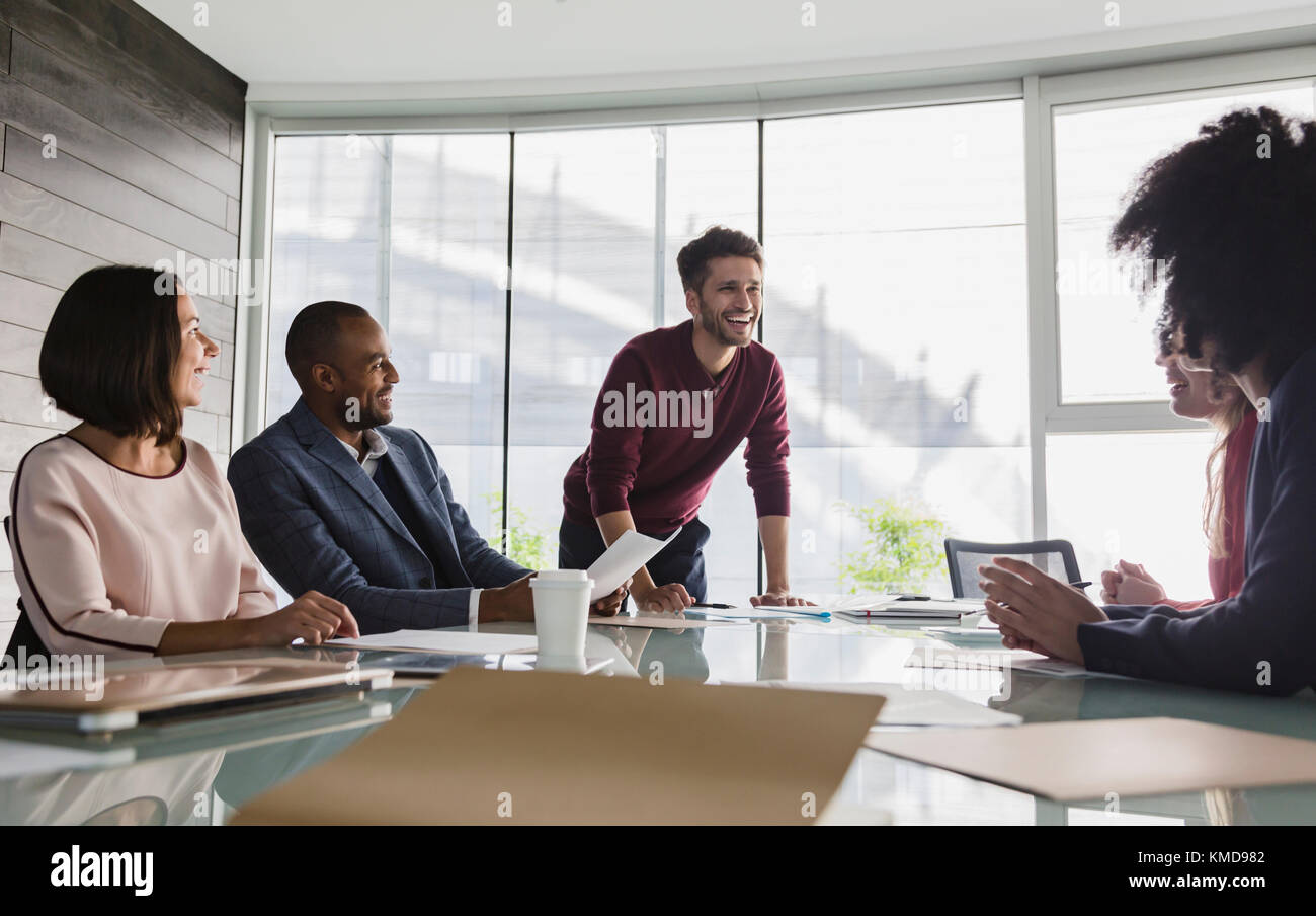 Smiling businessman leading conference room meeting Stock Photo - Alamy