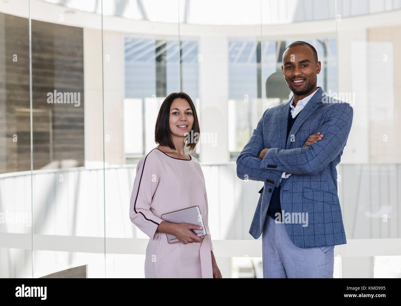 Portrait smiling,confident business people at office window Stock Photo ...