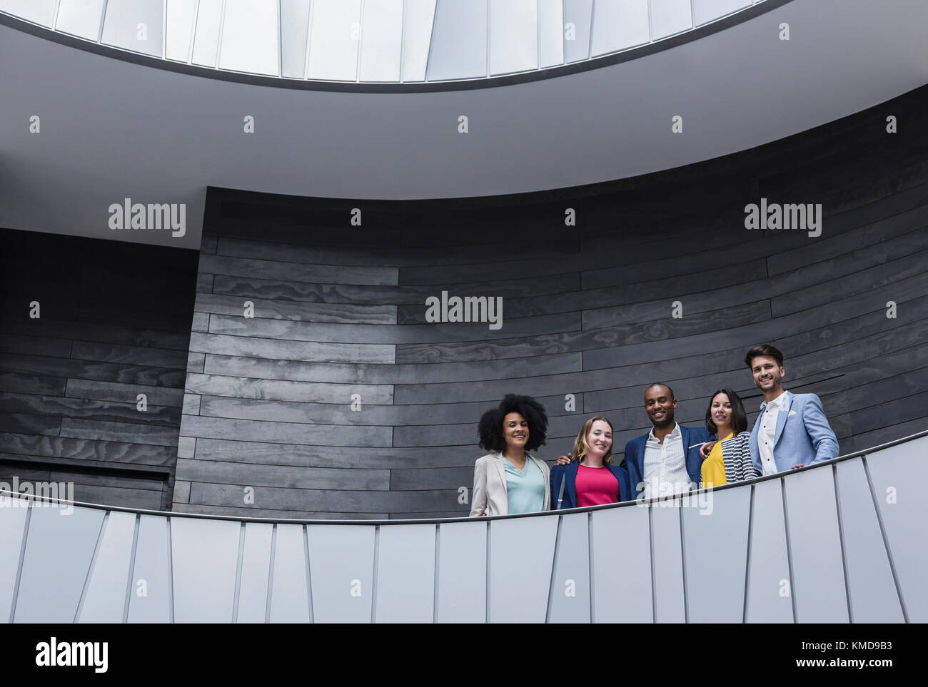 Portrait confident business people standing on office balcony Stock ...