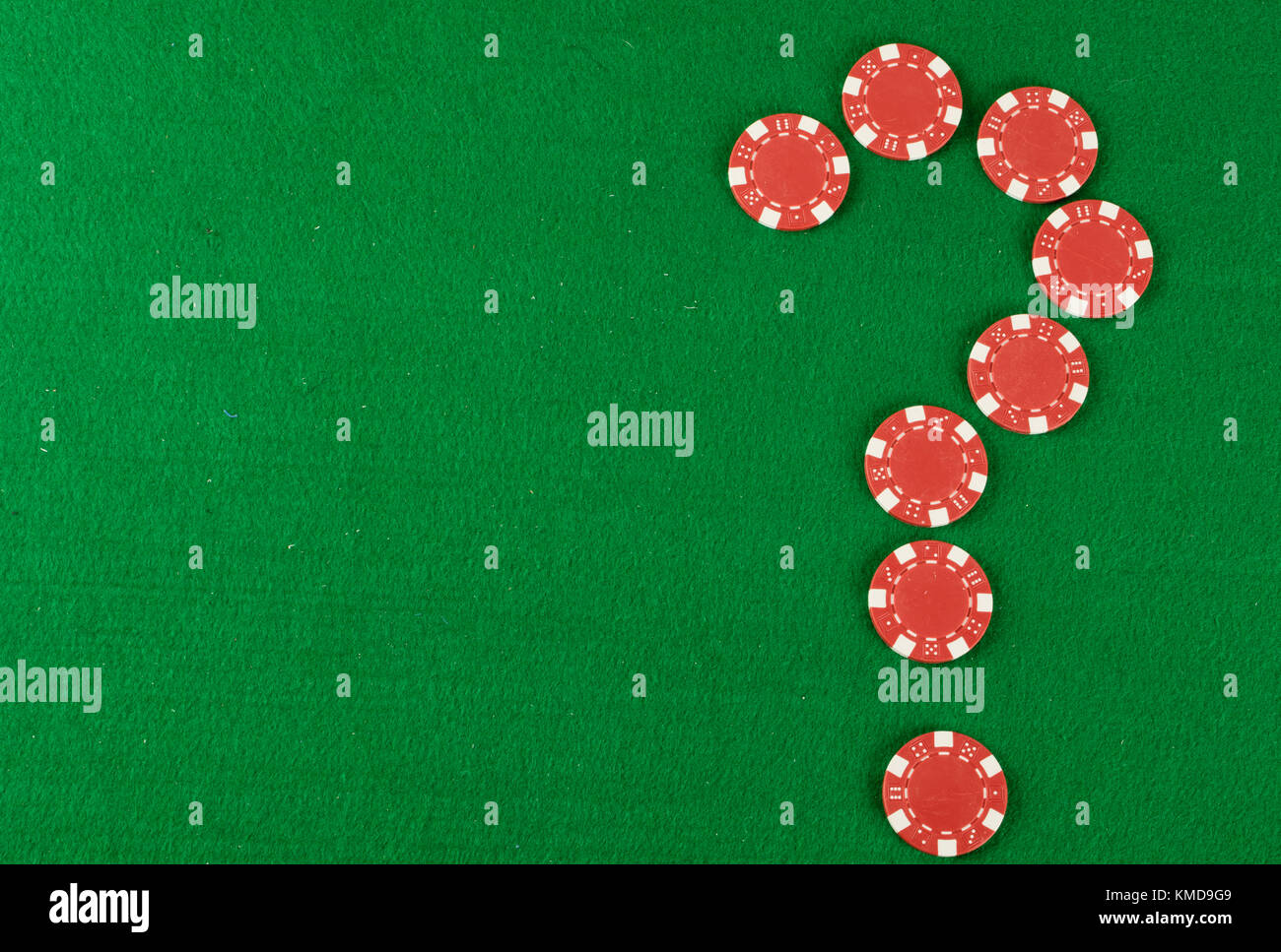 red poker chips over green background Stock Photo - Alamy