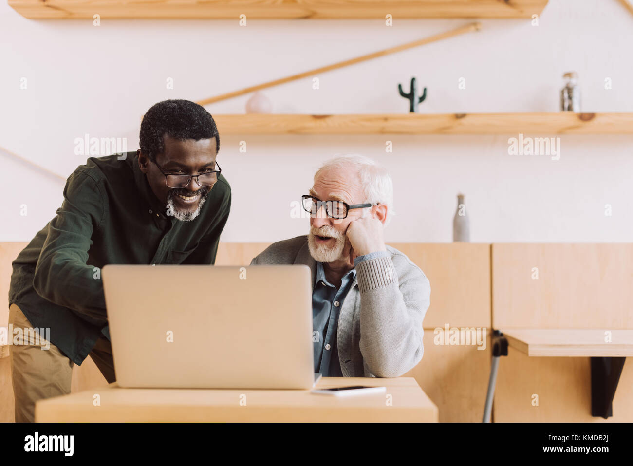 senior men using laptop Stock Photo - Alamy
