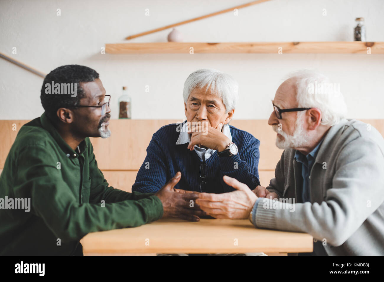 senior men having conversation Stock Photo - Alamy