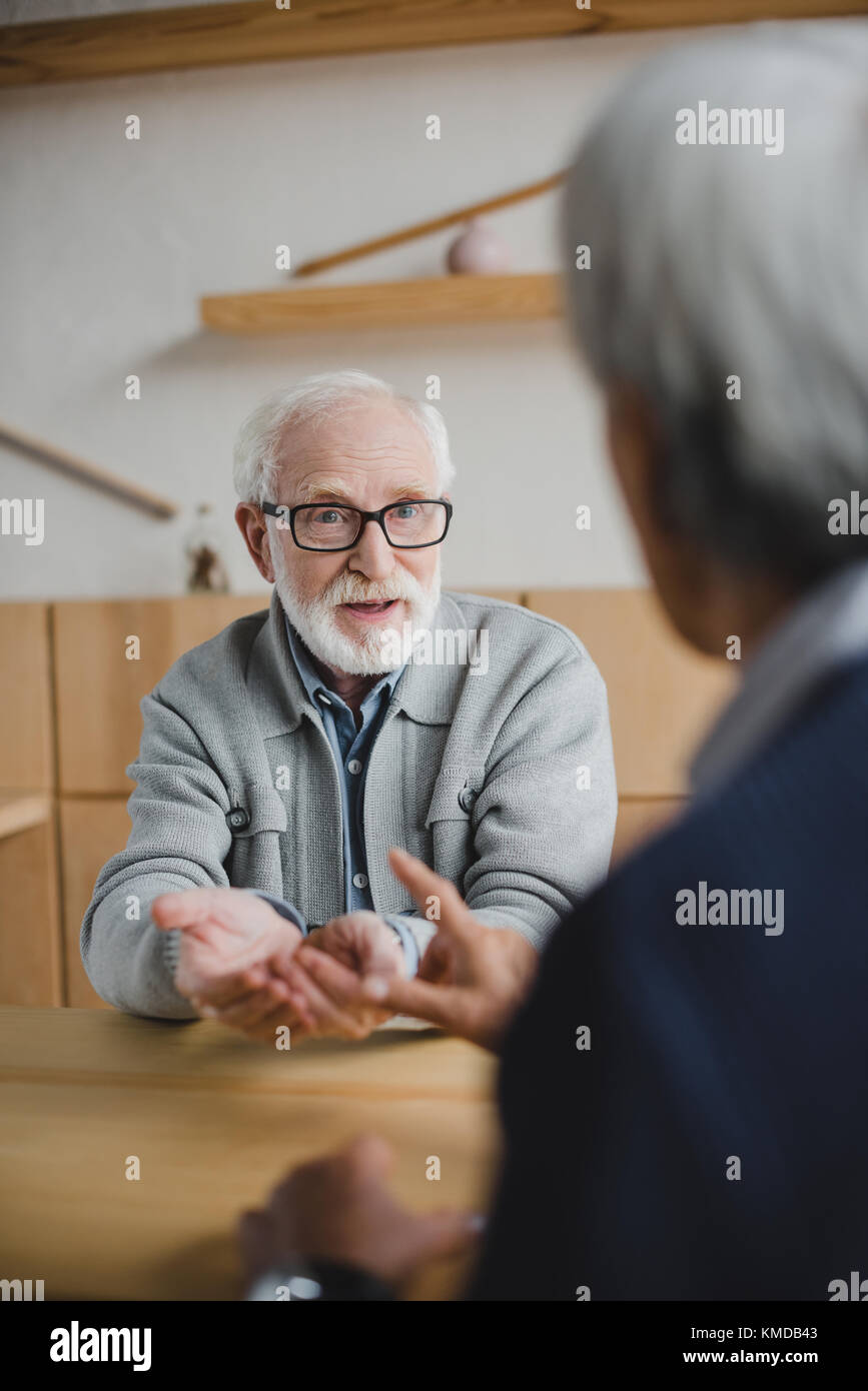senior friends having discussion Stock Photo - Alamy