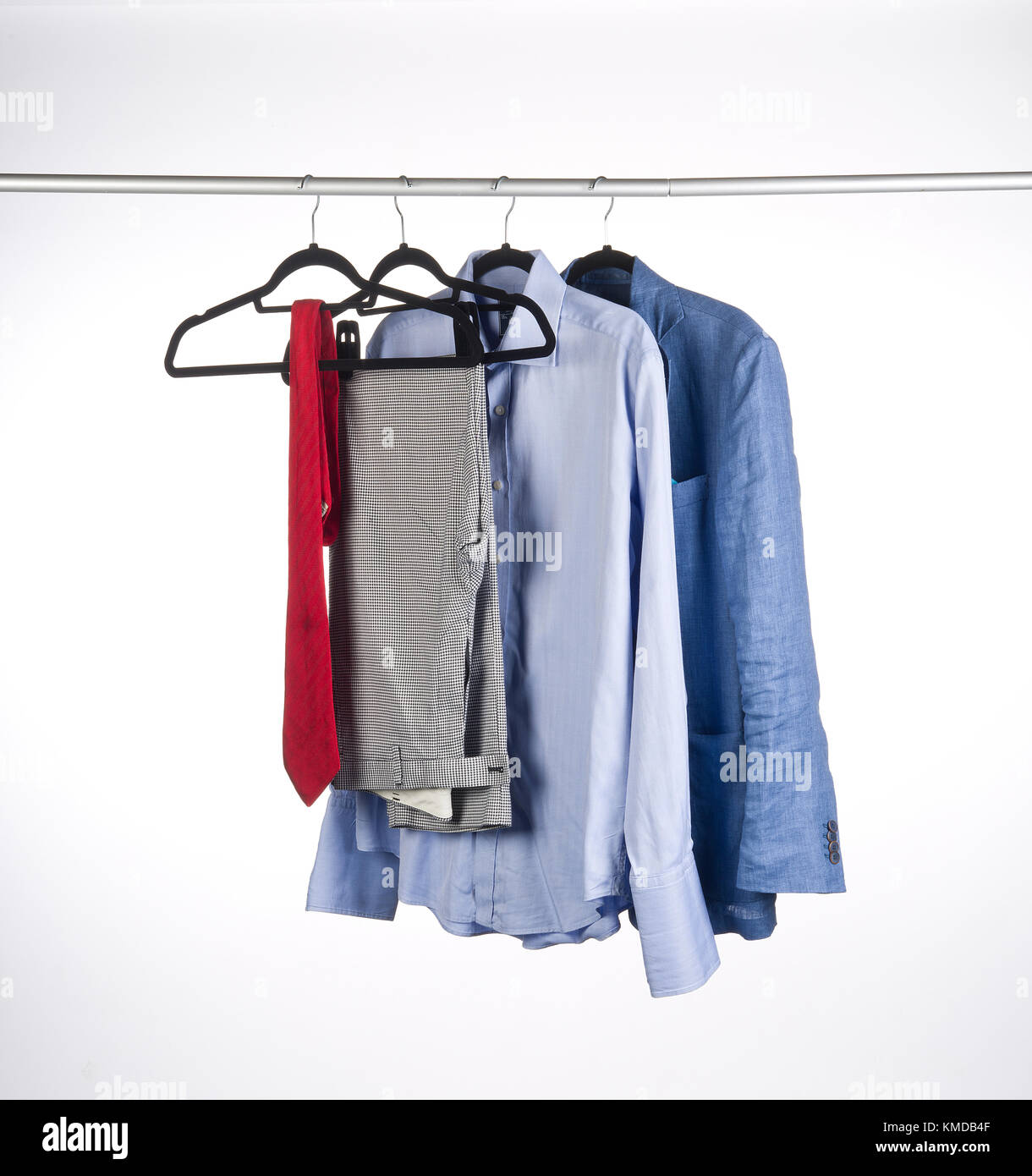 clothes on hangers, hanging on a clothes rail Stock Photo - Alamy
