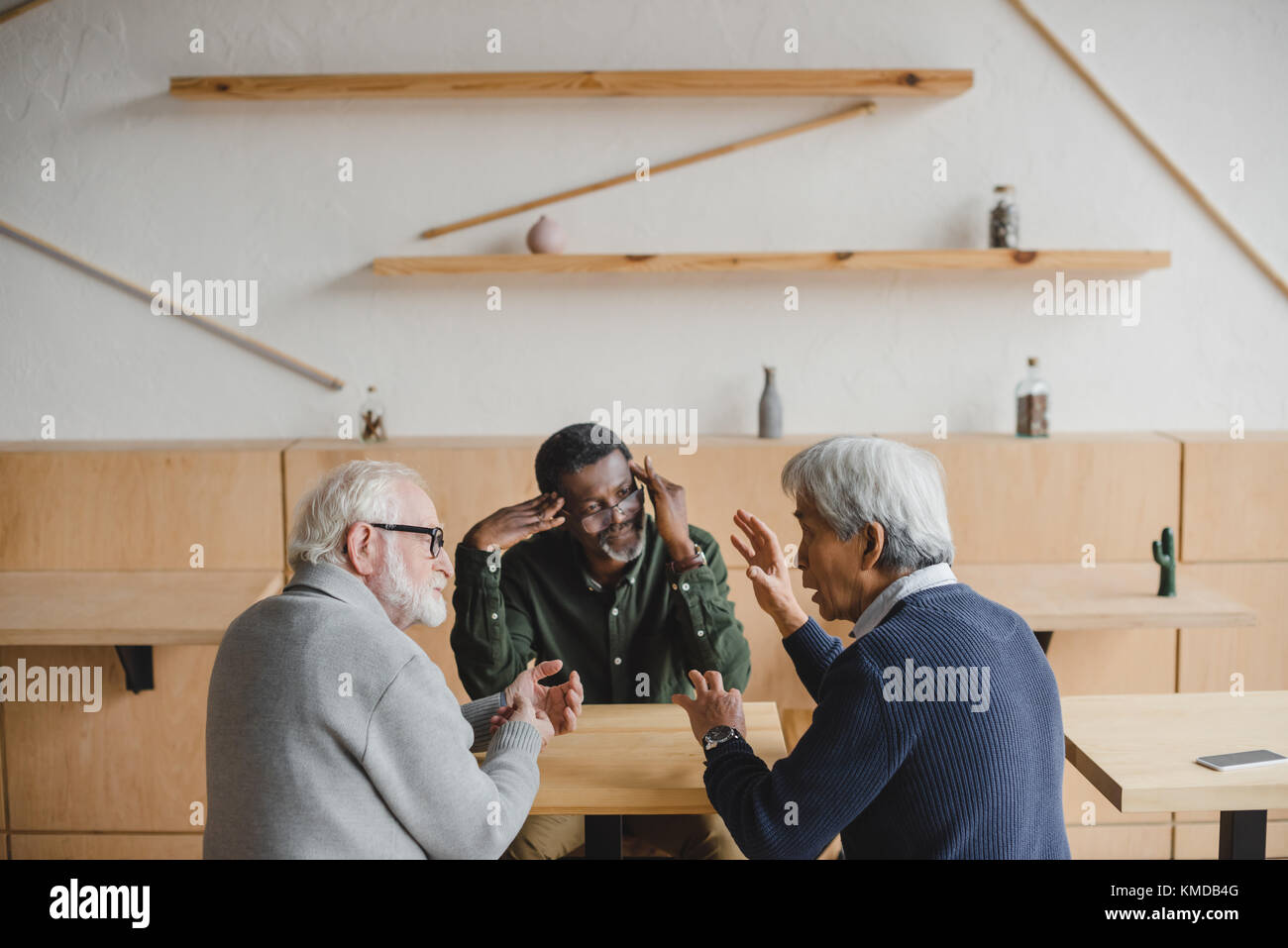 senior friends having discuss Stock Photo - Alamy