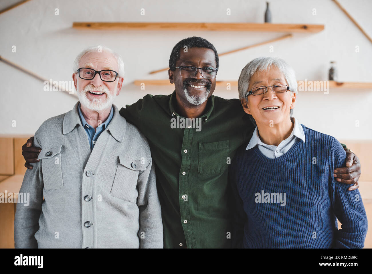 embracing senior friends Stock Photo - Alamy