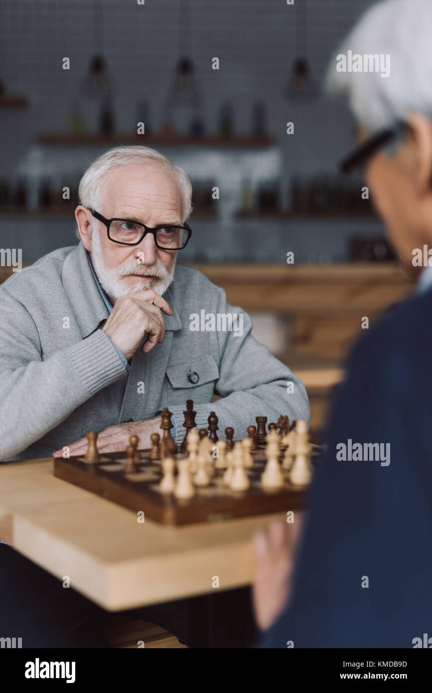 senior men playing chess Stock Photo - Alamy