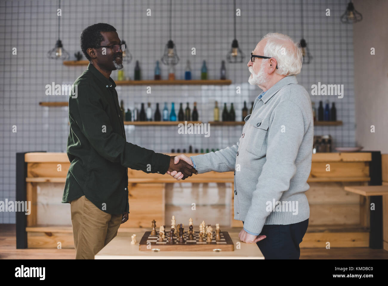 senior men playing chess Stock Photo - Alamy