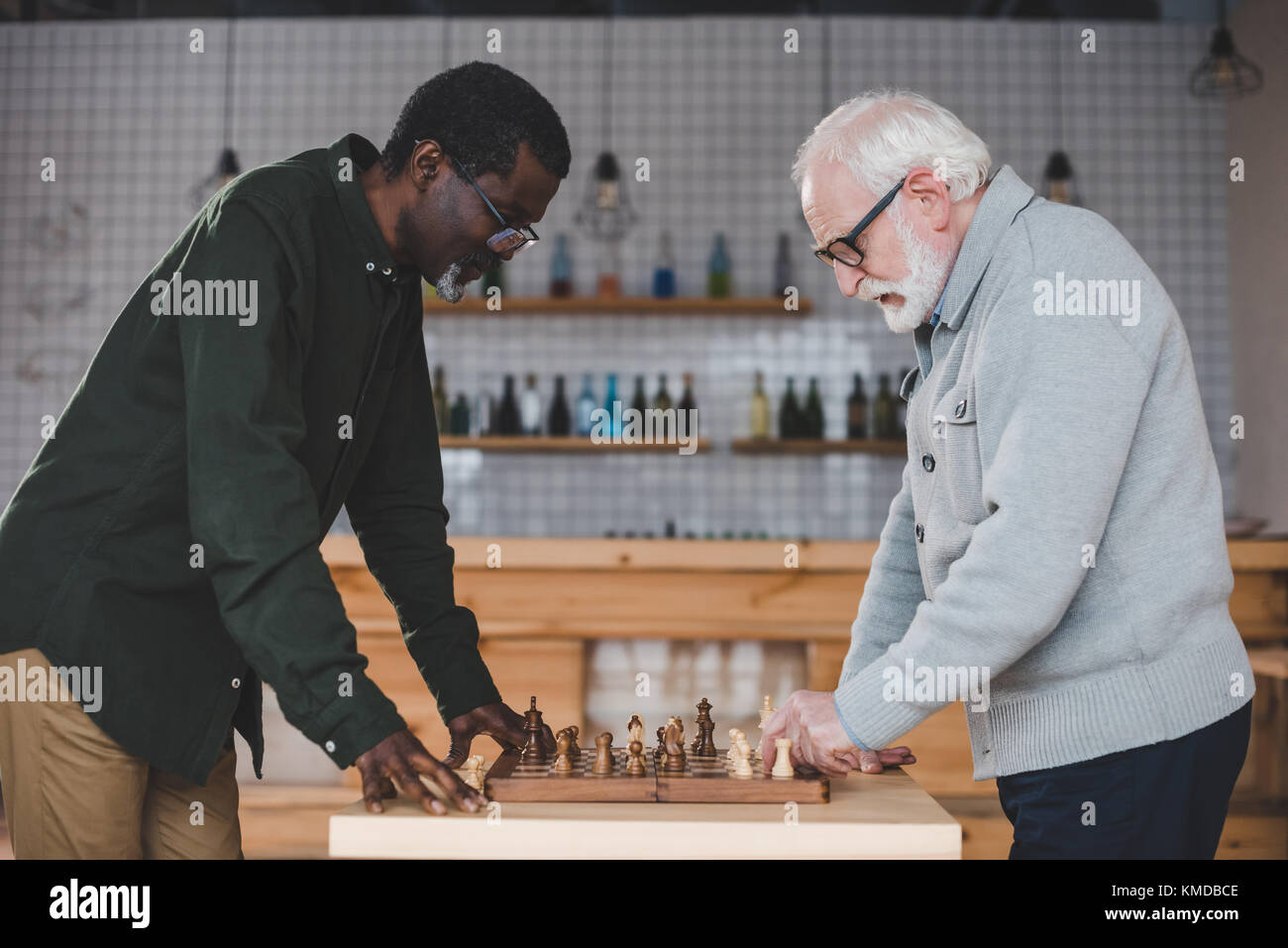 senior men playing chess Stock Photo - Alamy