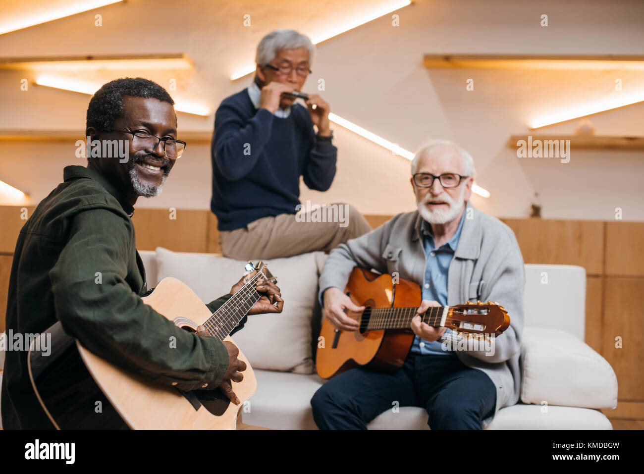 senior friends playing music Stock Photo - Alamy