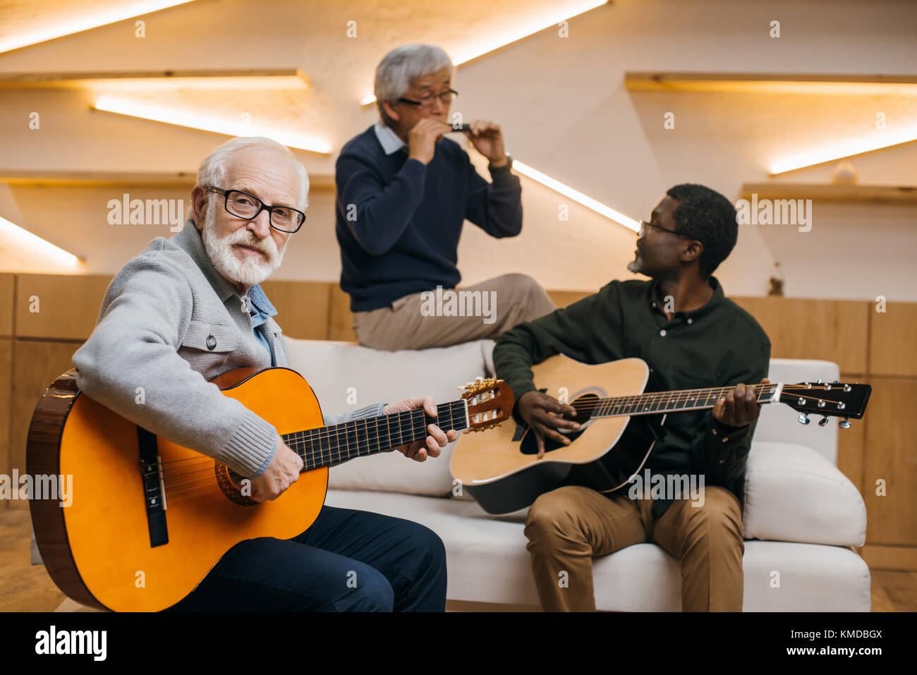 senior friends playing music Stock Photo - Alamy