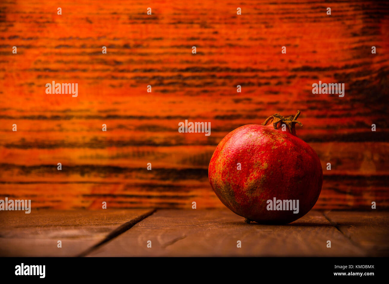ripe pomegranate on wooden boards. juicy pomegranate on wooden boards ...