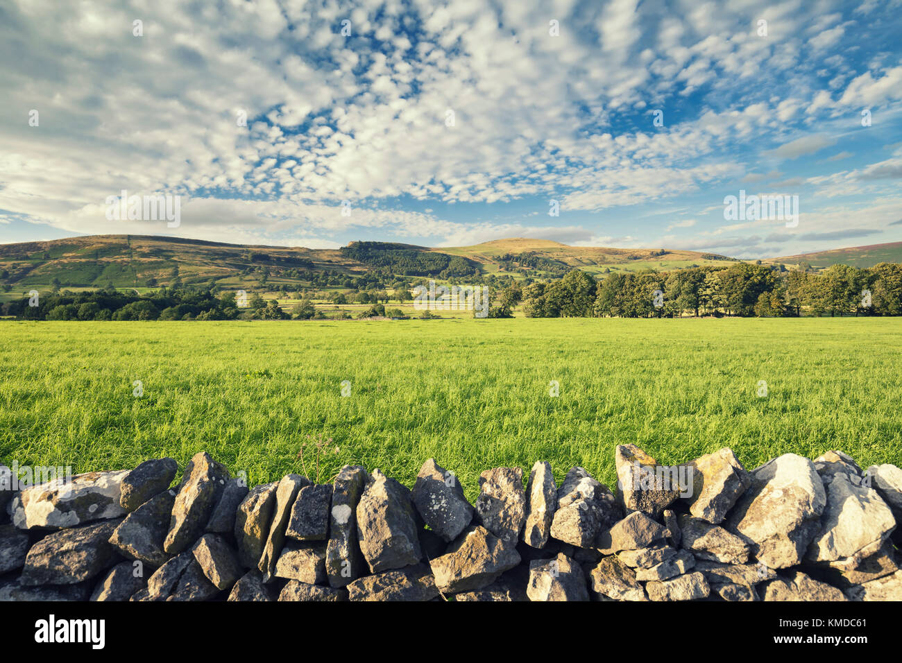 Scenic Fields at Summer Through the Stone Wall of British Countryside ...