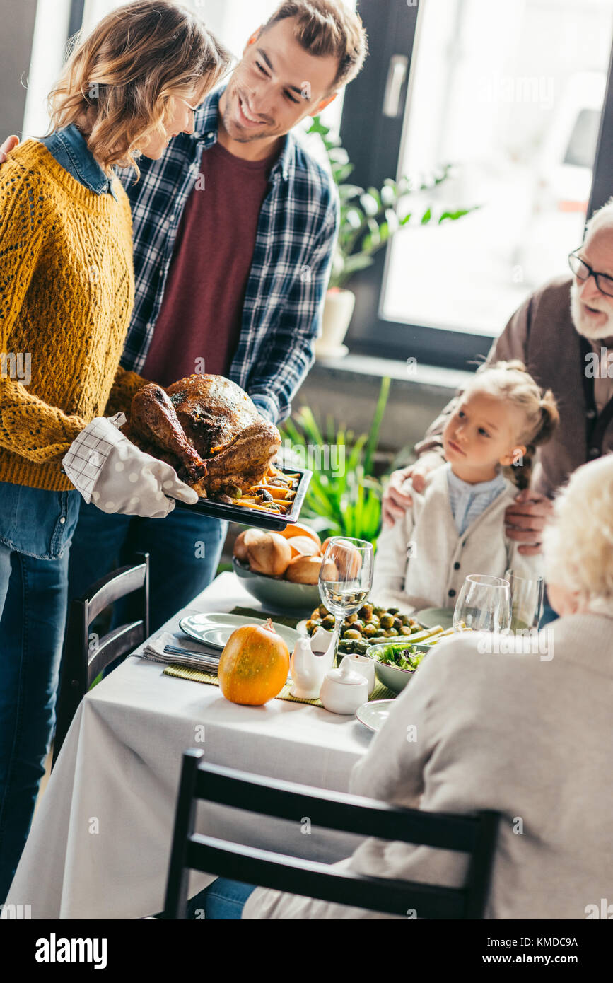 family looking at thanksgiving turkey Stock Photo - Alamy