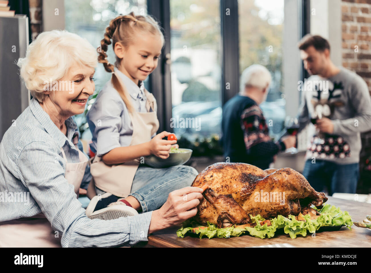 grandmother and granddaughter with turkey for holiday dinner Stock ...