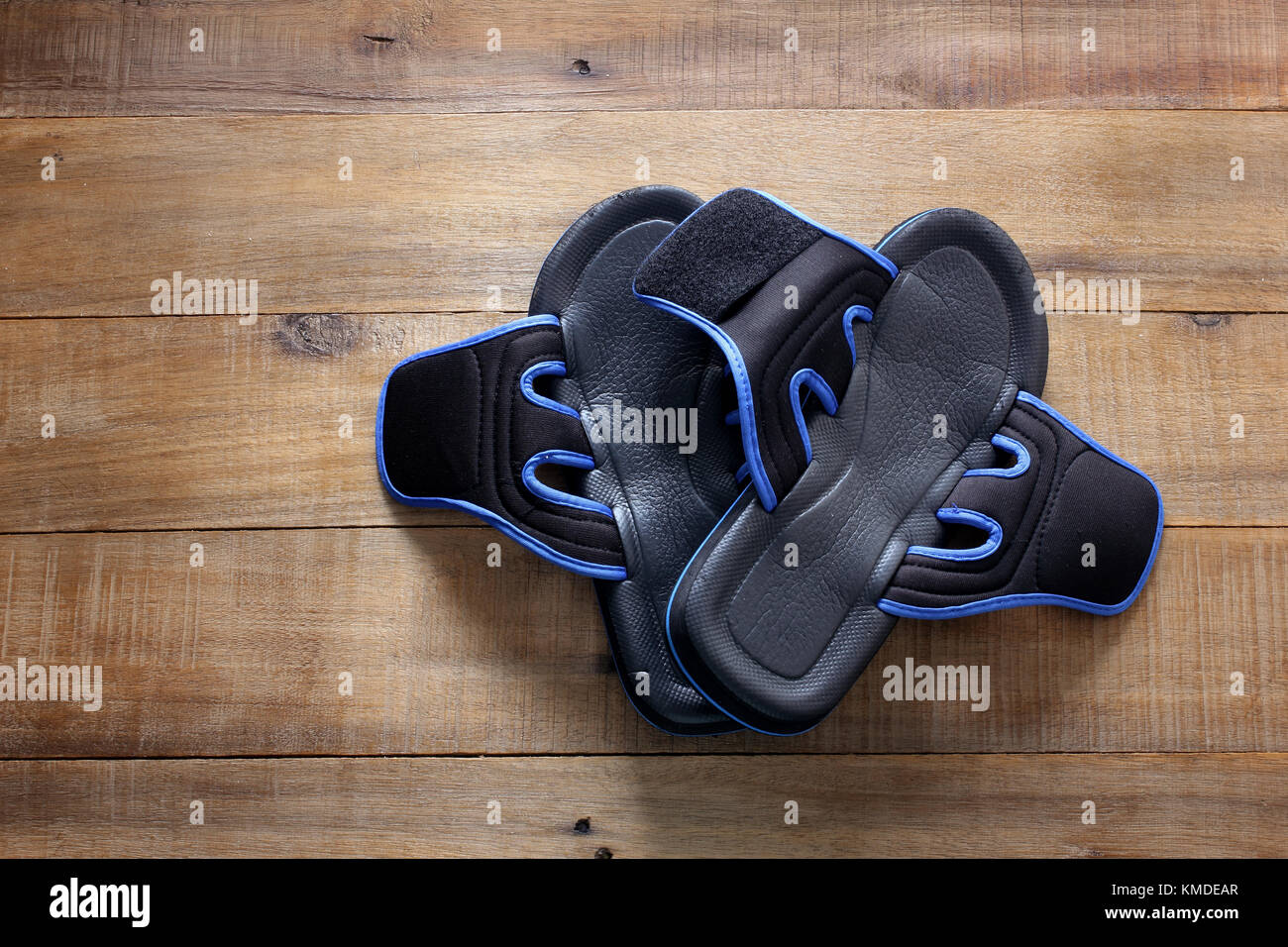 Slippers on Wooden Background Stock Photo - Alamy