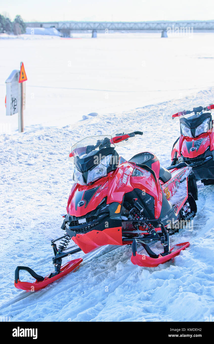 Rovaniemi, Finland - March 4, 2017: Red snowmobiles in frozen lake at ...