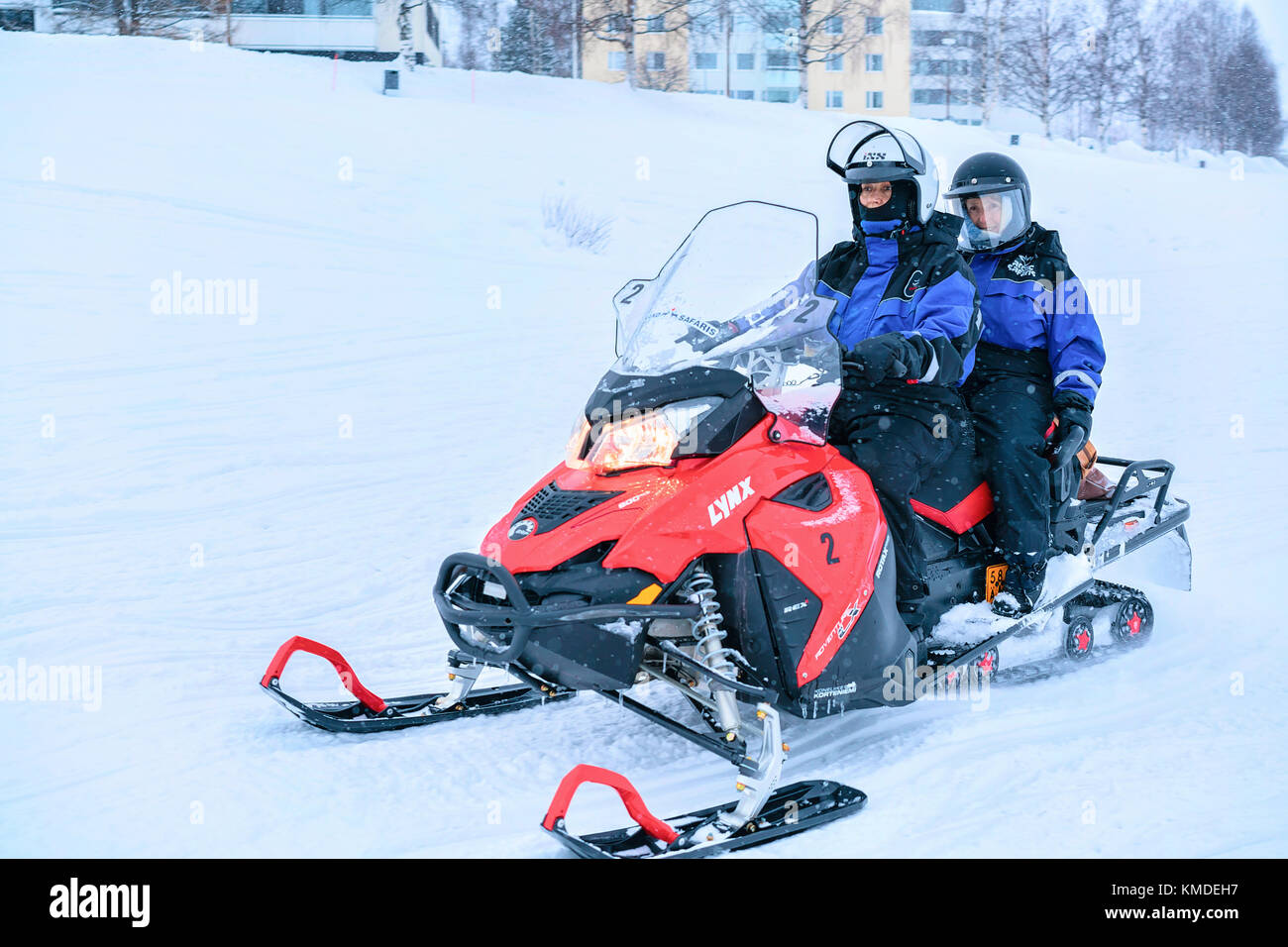 Woman on snowmobile in forest hi-res stock photography and images - Alamy