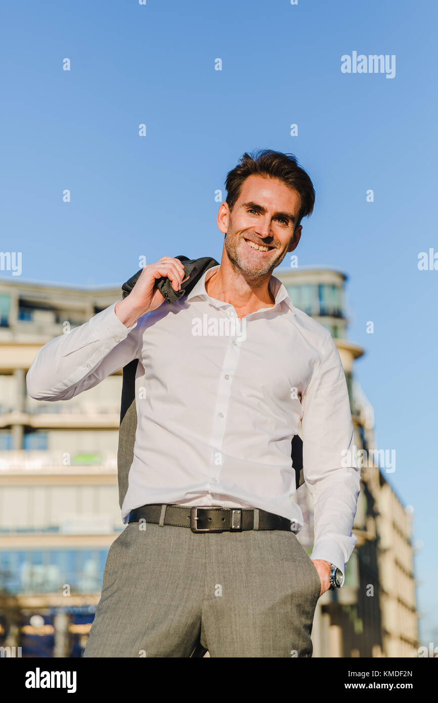 picture of a businessman who throws his jacket over the shoulder Stock ...