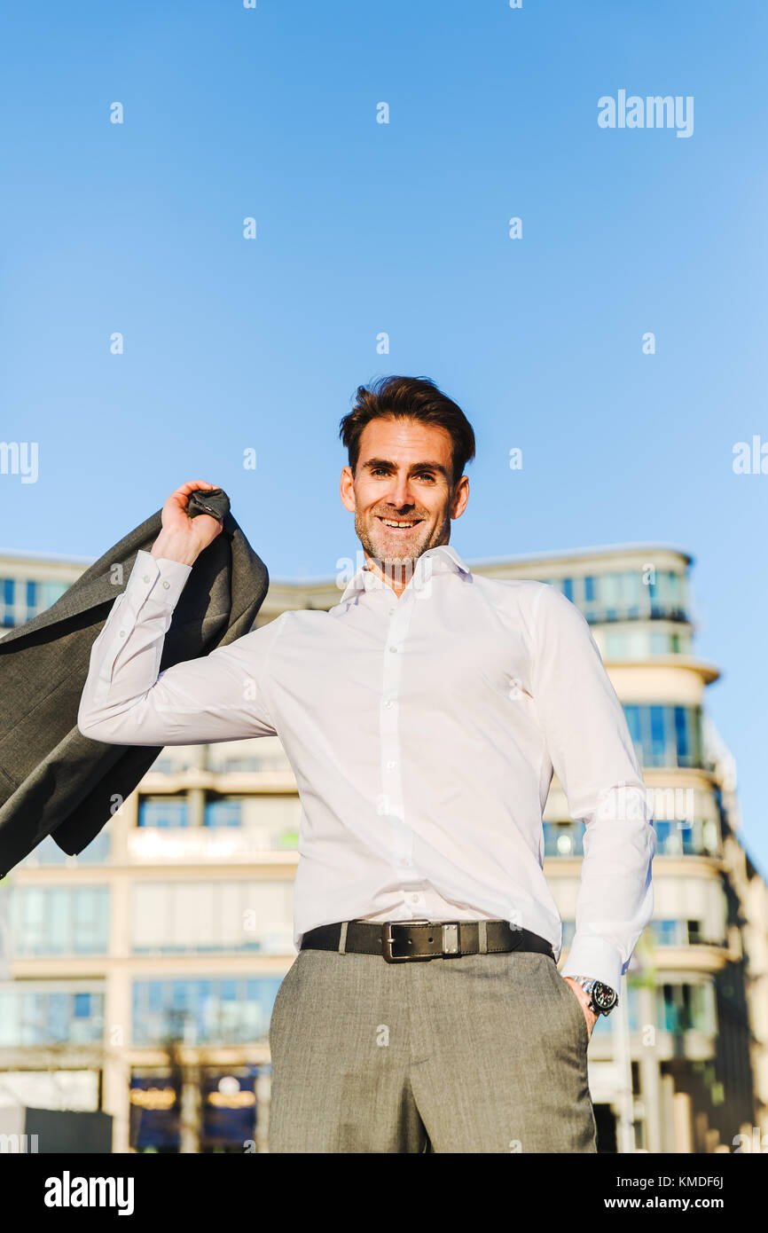 picture of a businessman who throws his jacket over the shoulder Stock ...