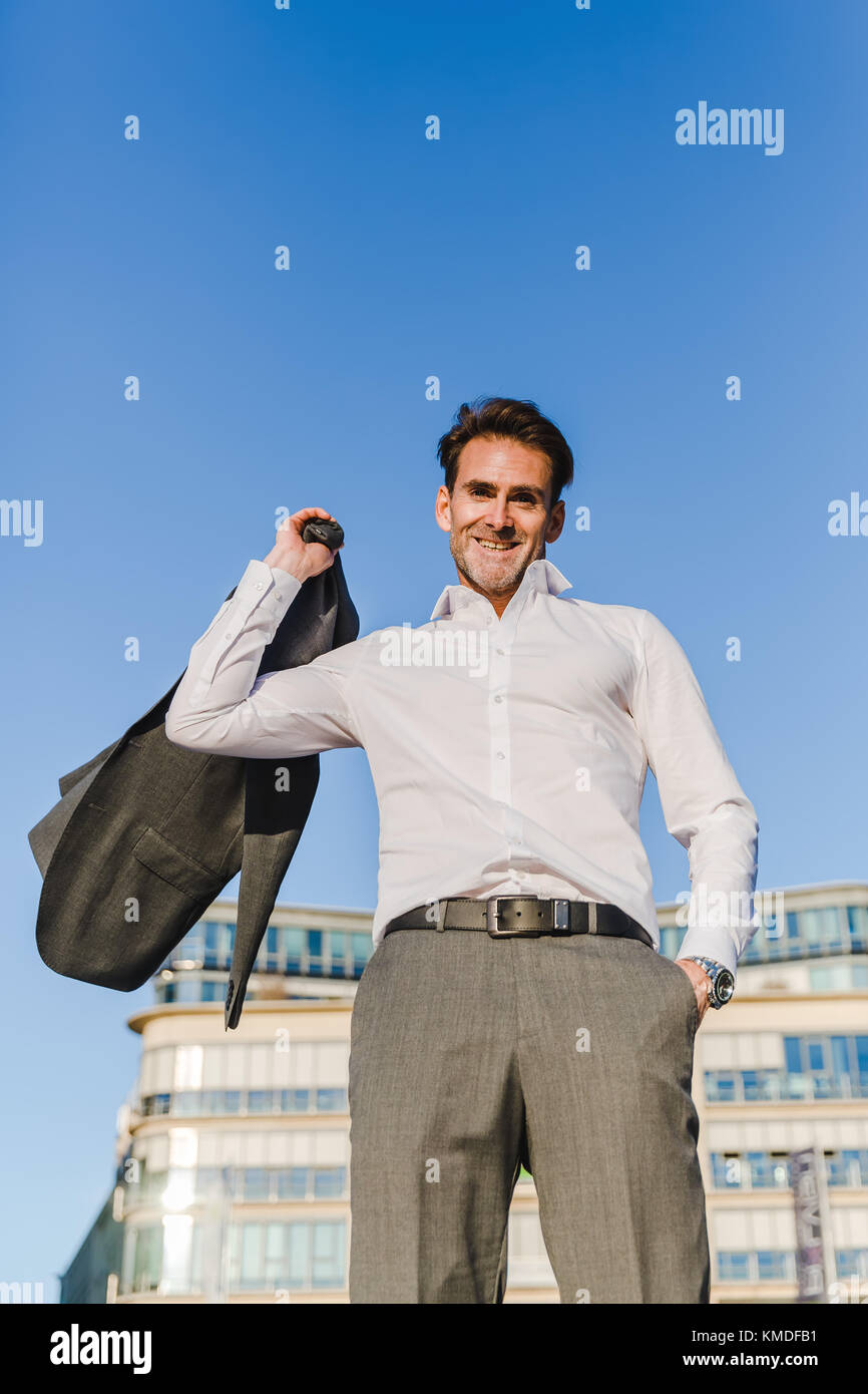 picture of a businessman who throws his jacket over the shoulder Stock ...