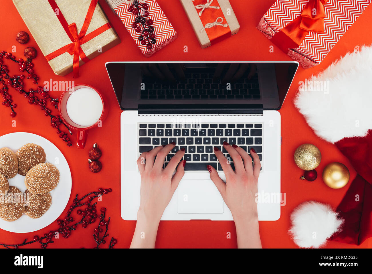 woman using laptop at christmastime Stock Photo - Alamy