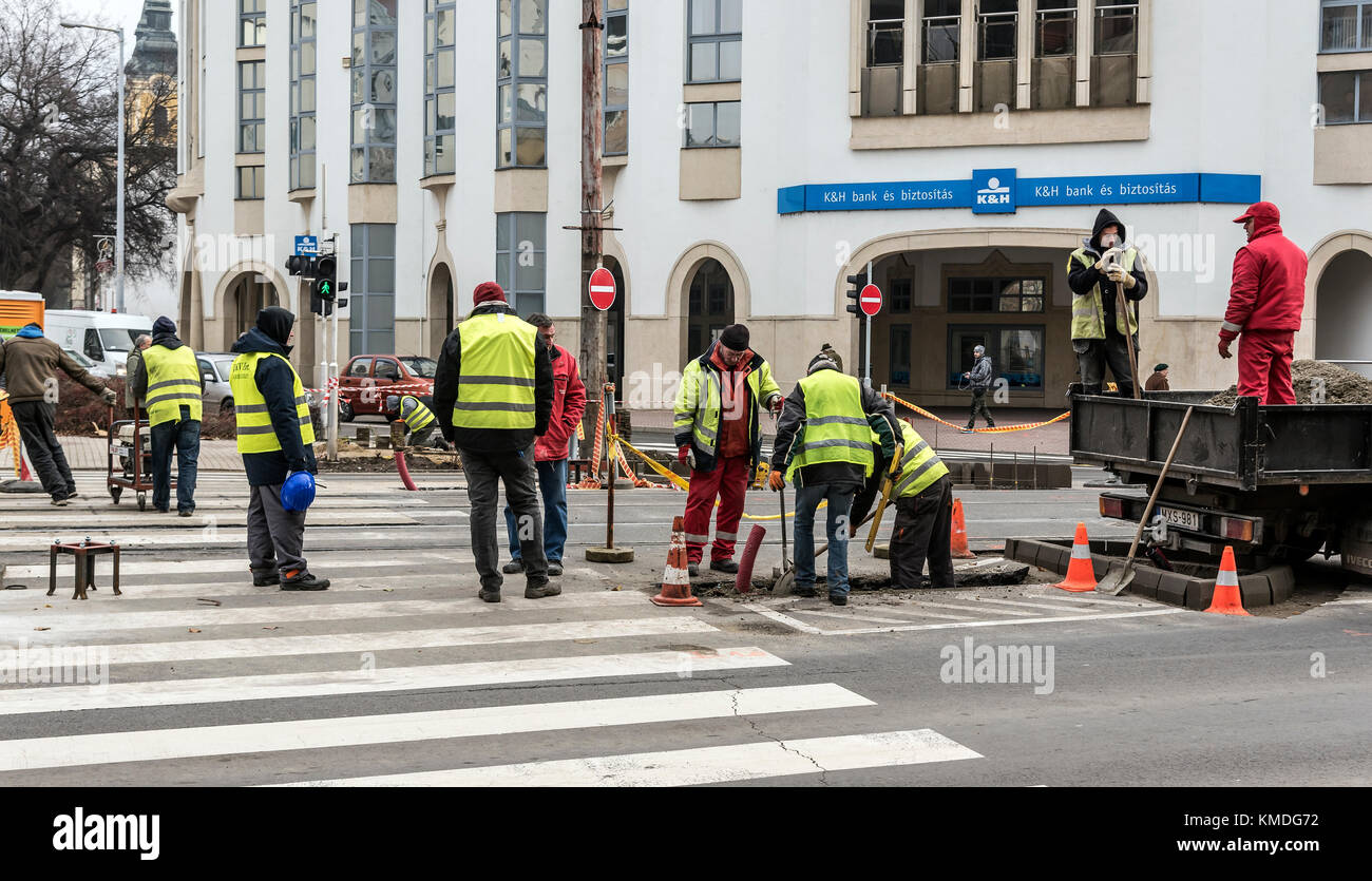 Workers on a road construction, industry and teamwork Stock Photo - Alamy
