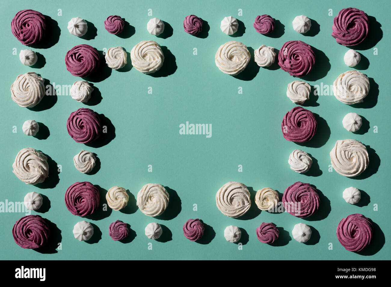 frame of marshmallows on turquoise surface Stock Photo - Alamy