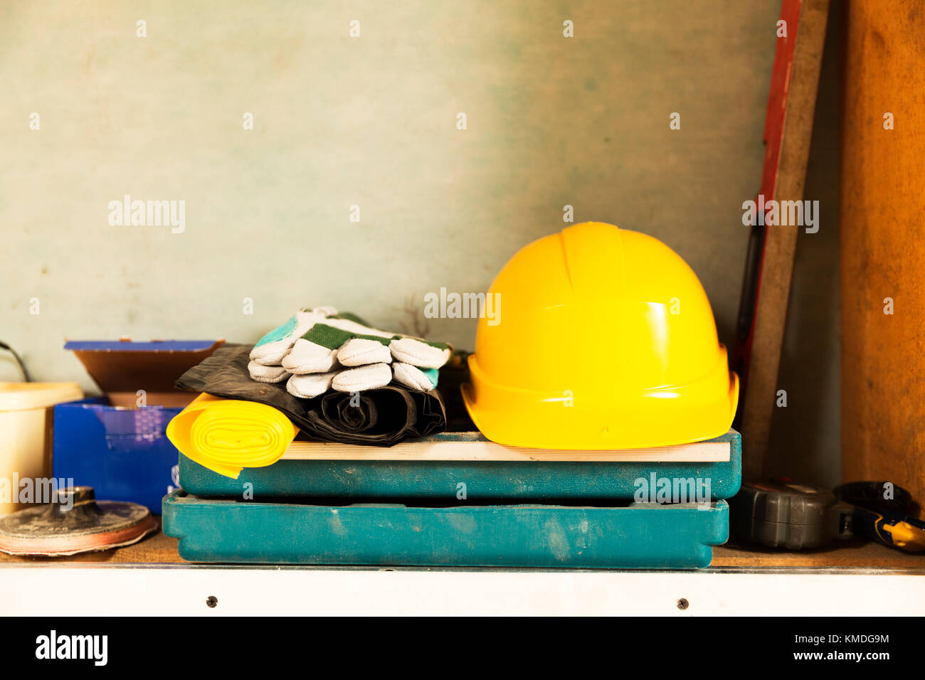 Attic construction and renovation tools, yellow safety helmet, gloves ...