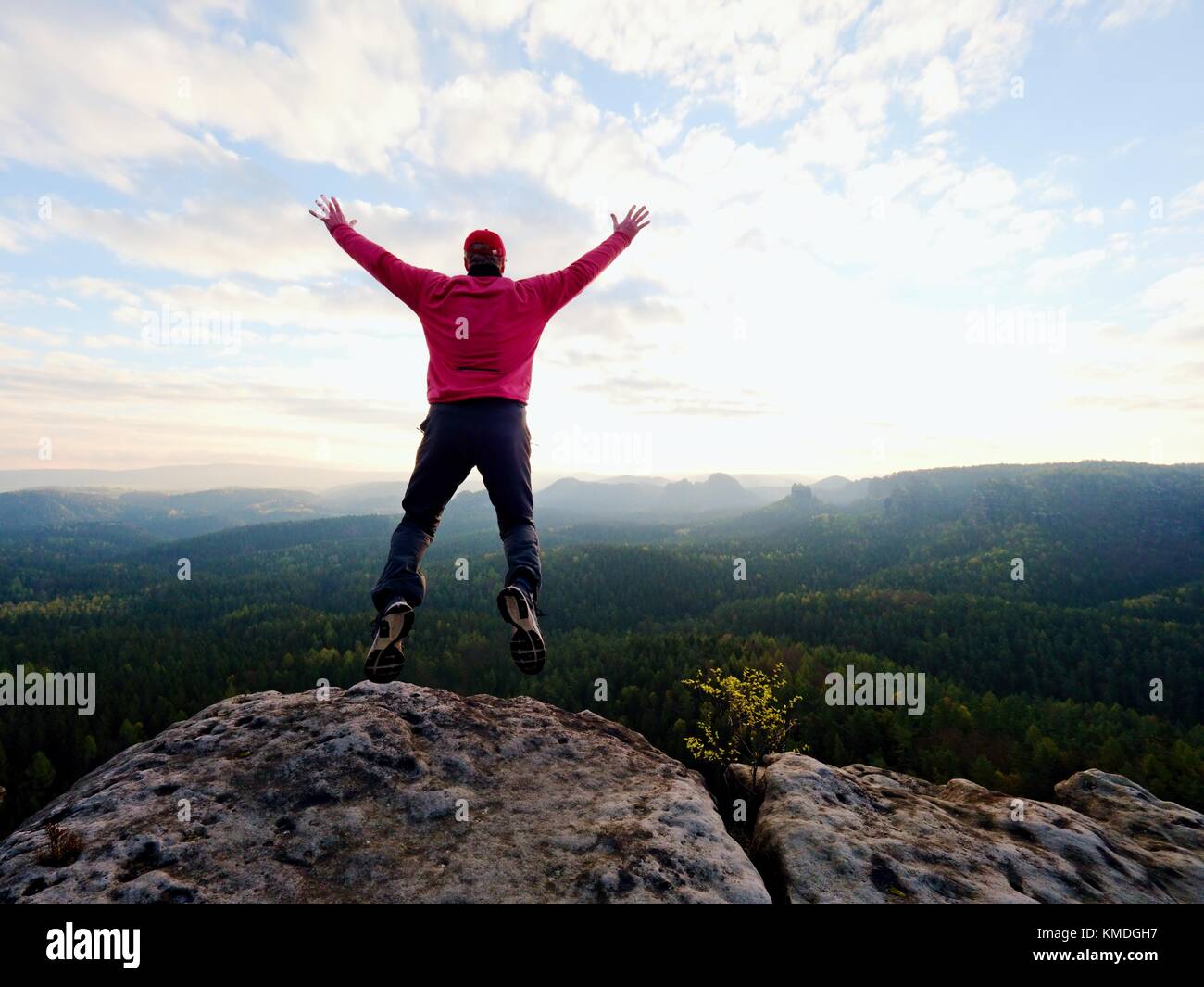 Man dangerously jumping on the edge. Man jump. Young man falling down ...