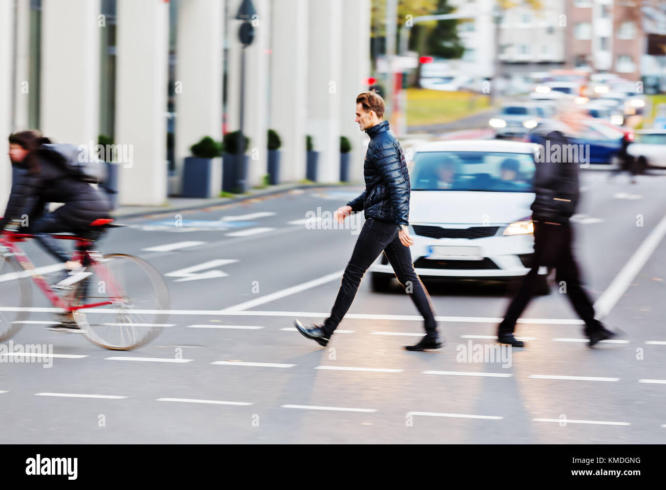 motion blur picture of a man who crosses a city street Stock Photo - Alamy