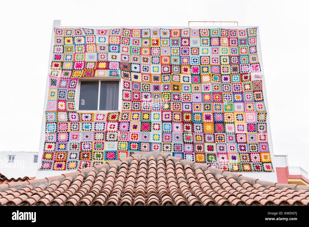 Patchwork crochet wall hanging on outside upstairs wall above a craft ...