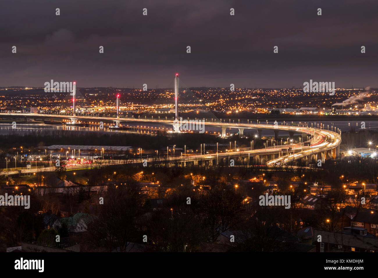 Light trails from rush hour traffic crossing the Mersey Gateway Toll ...