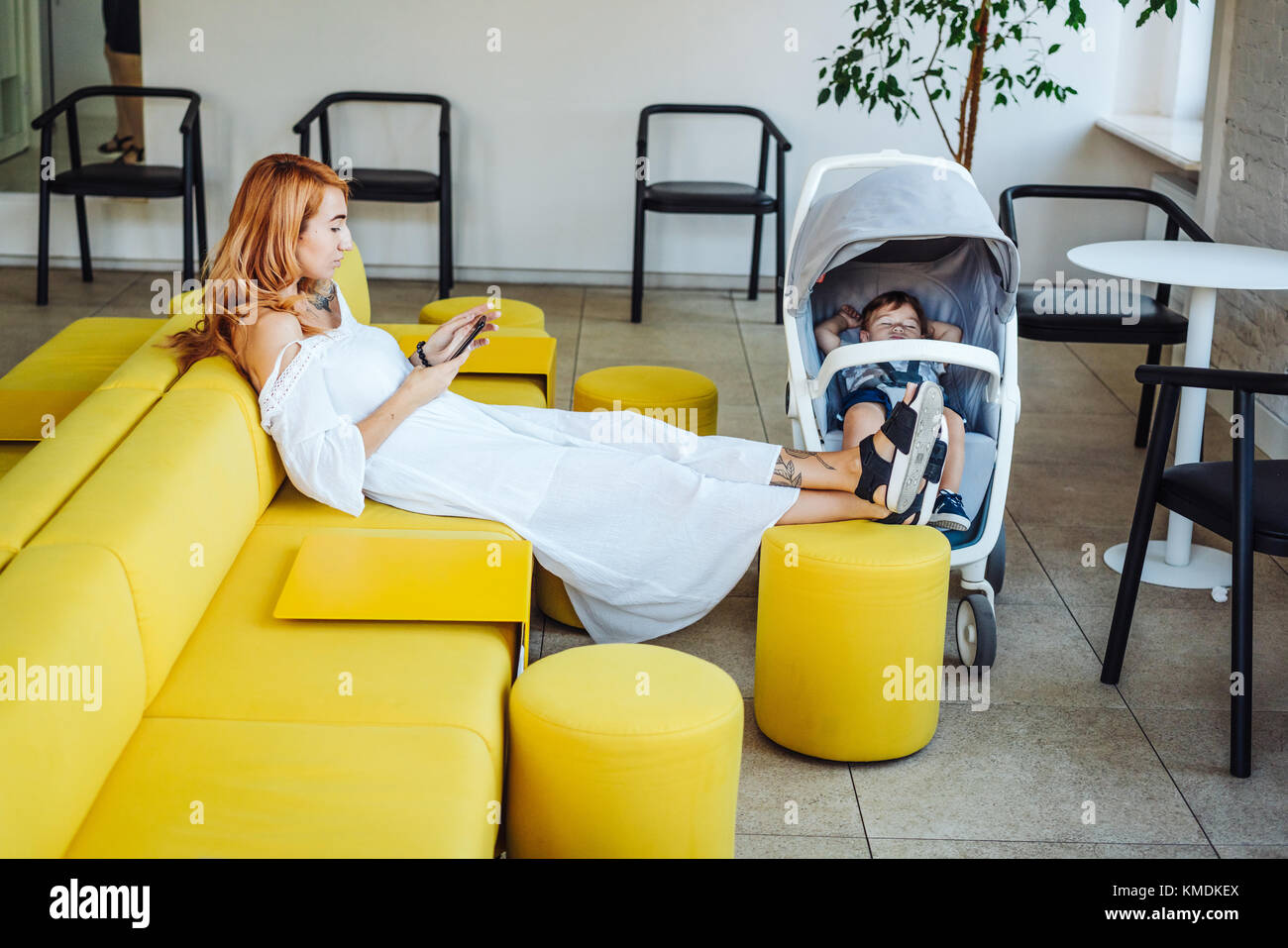 Mom and stroller with her baby Stock Photo - Alamy