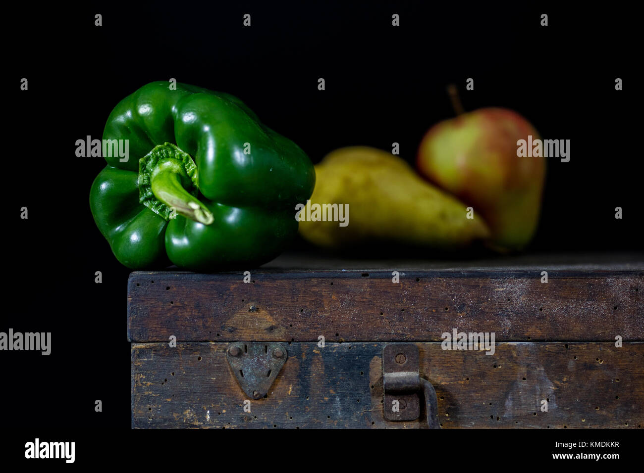 Paprika on an old wooden box. Vegetable on an old box. Black background ...