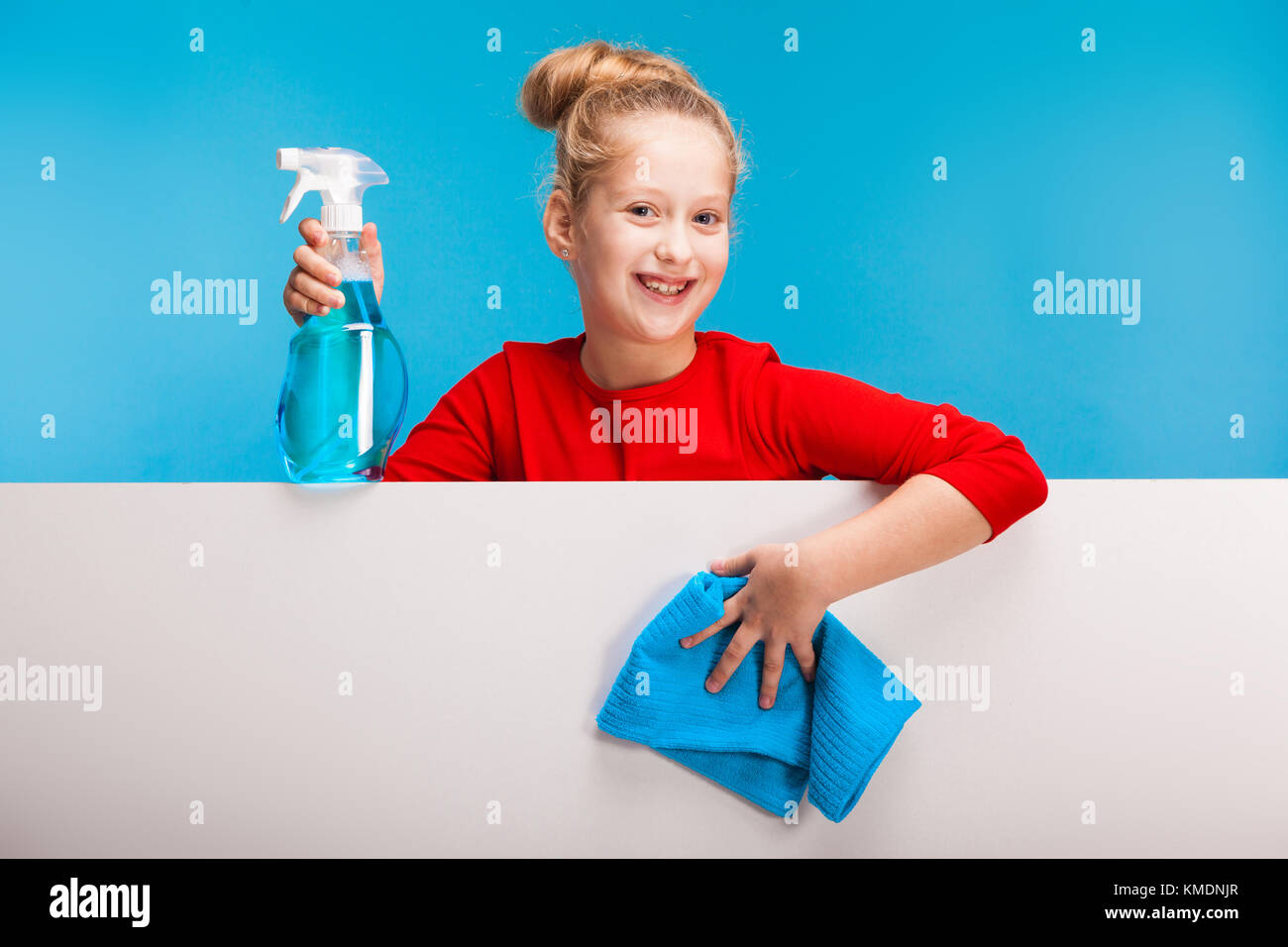 a little girl with cleaning products Stock Photo - Alamy