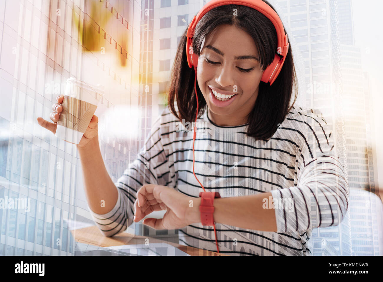 Relaxed office worker checking her time Stock Photo - Alamy