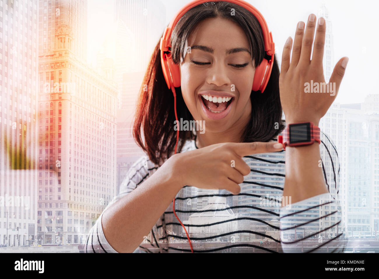 Happy girl pointing at her left hand Stock Photo - Alamy