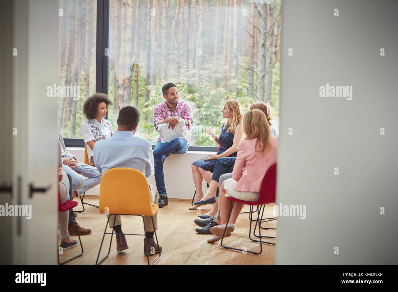 Woman talking in group therapy session Stock Photo - Alamy
