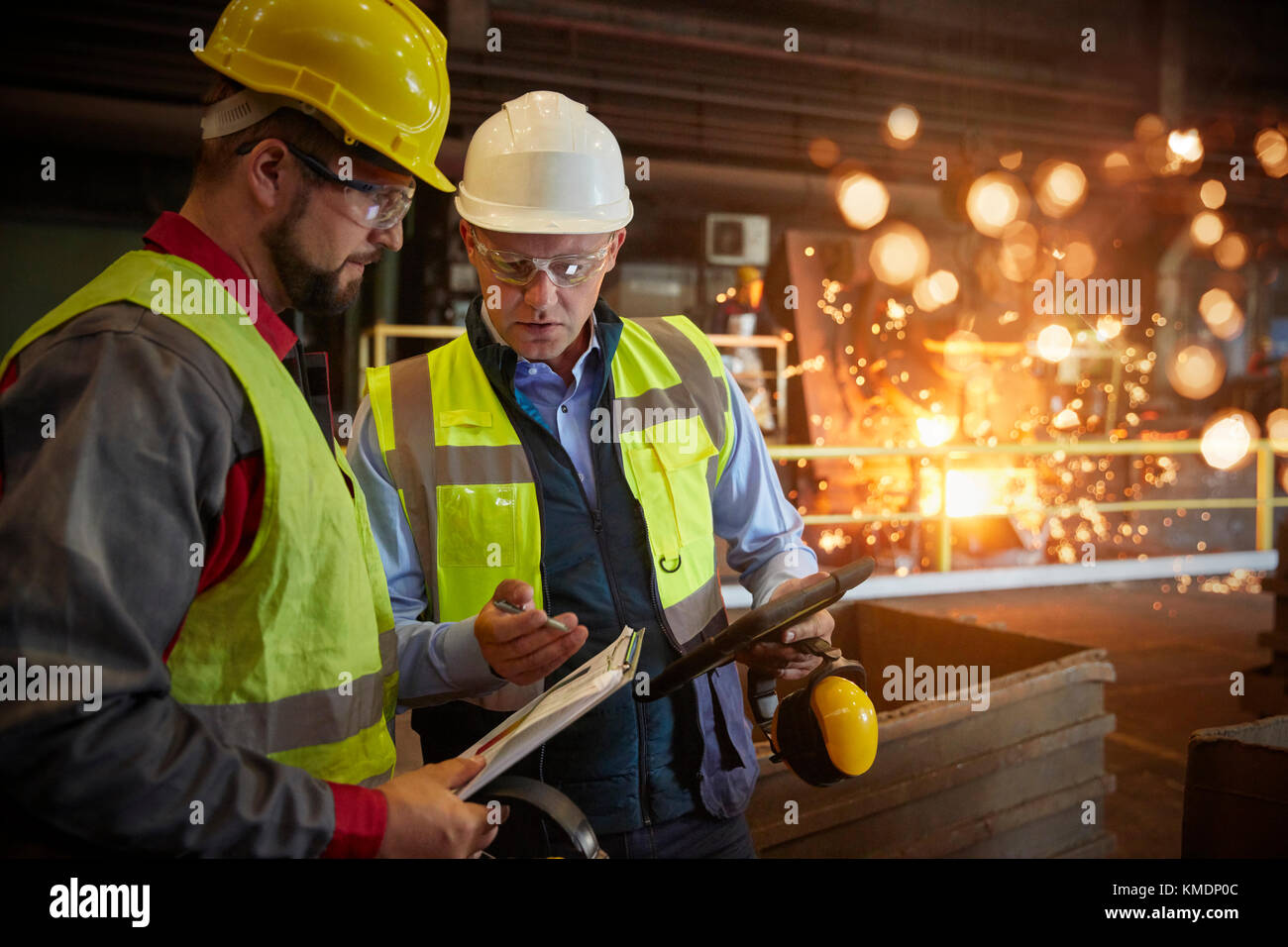Supervisor talking in steel factory hi-res stock photography and images ...