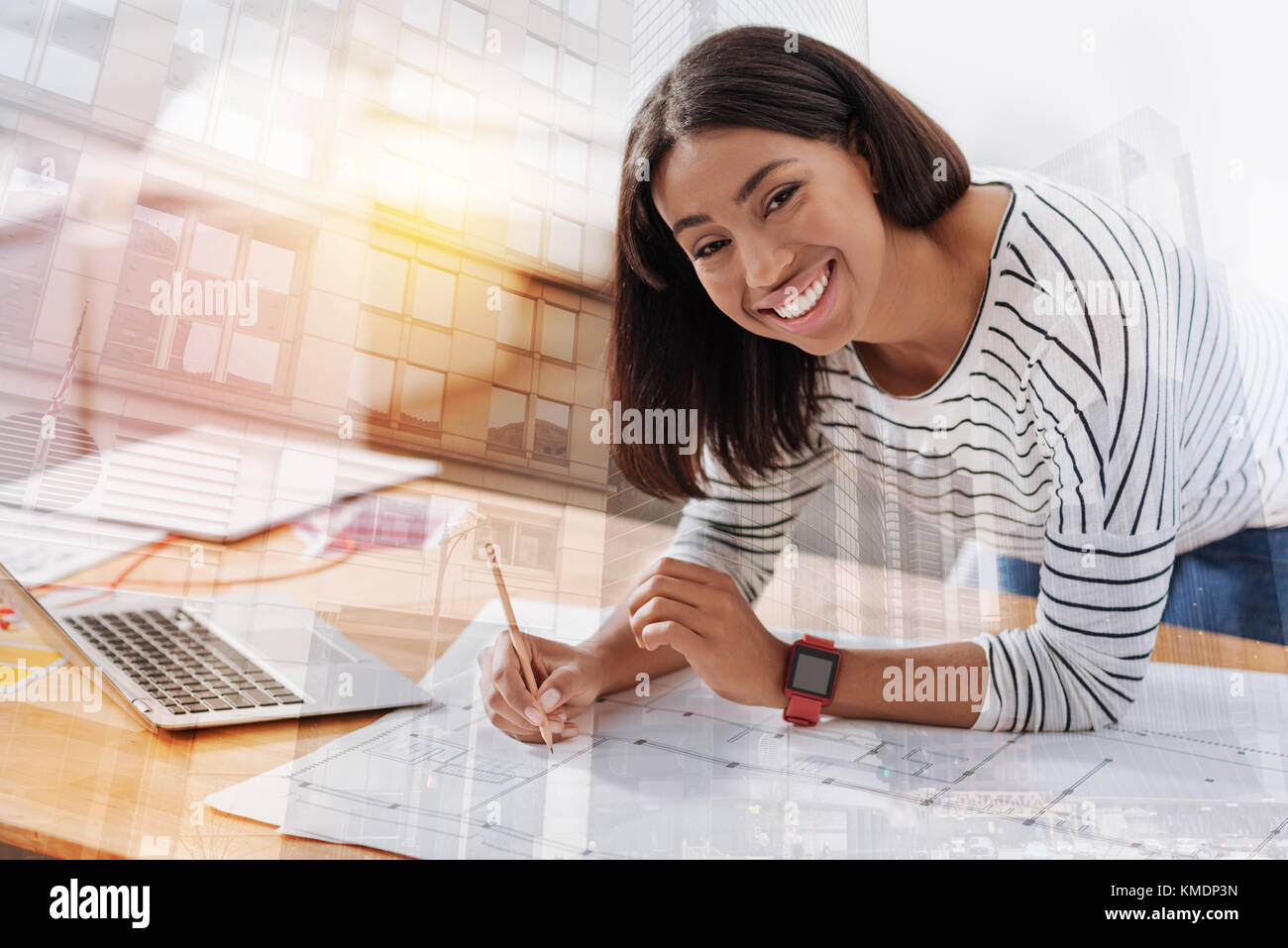 Joyful girl feeling happiness while working Stock Photo - Alamy
