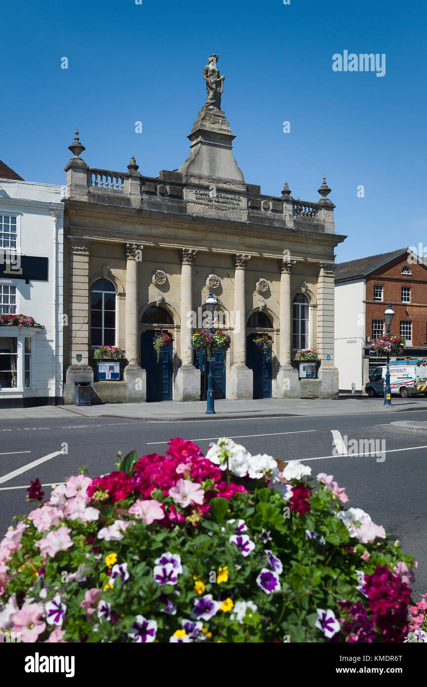Flowers brighten the centre of Devizes town with the old Corn Exchange ...